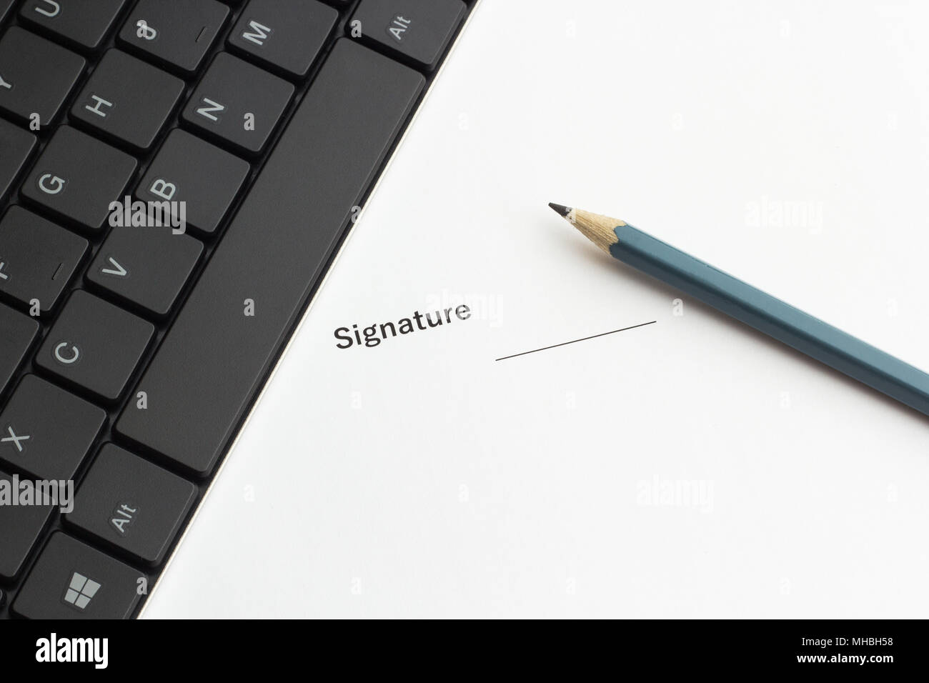 One document and a pencil for signing on the desktop, close-up Stock ...