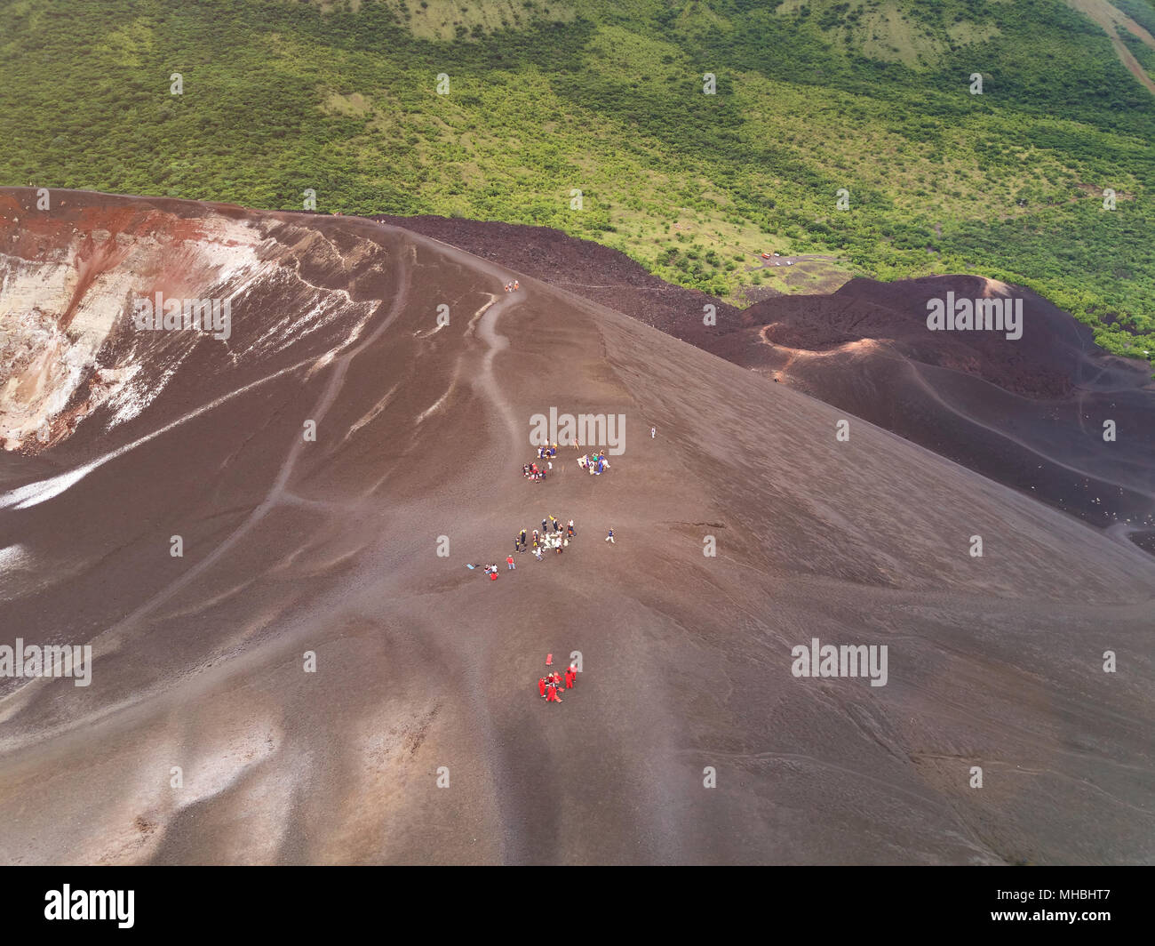 Volcano boarding activity in Nicaragua. People on CerroNegro volcano ...