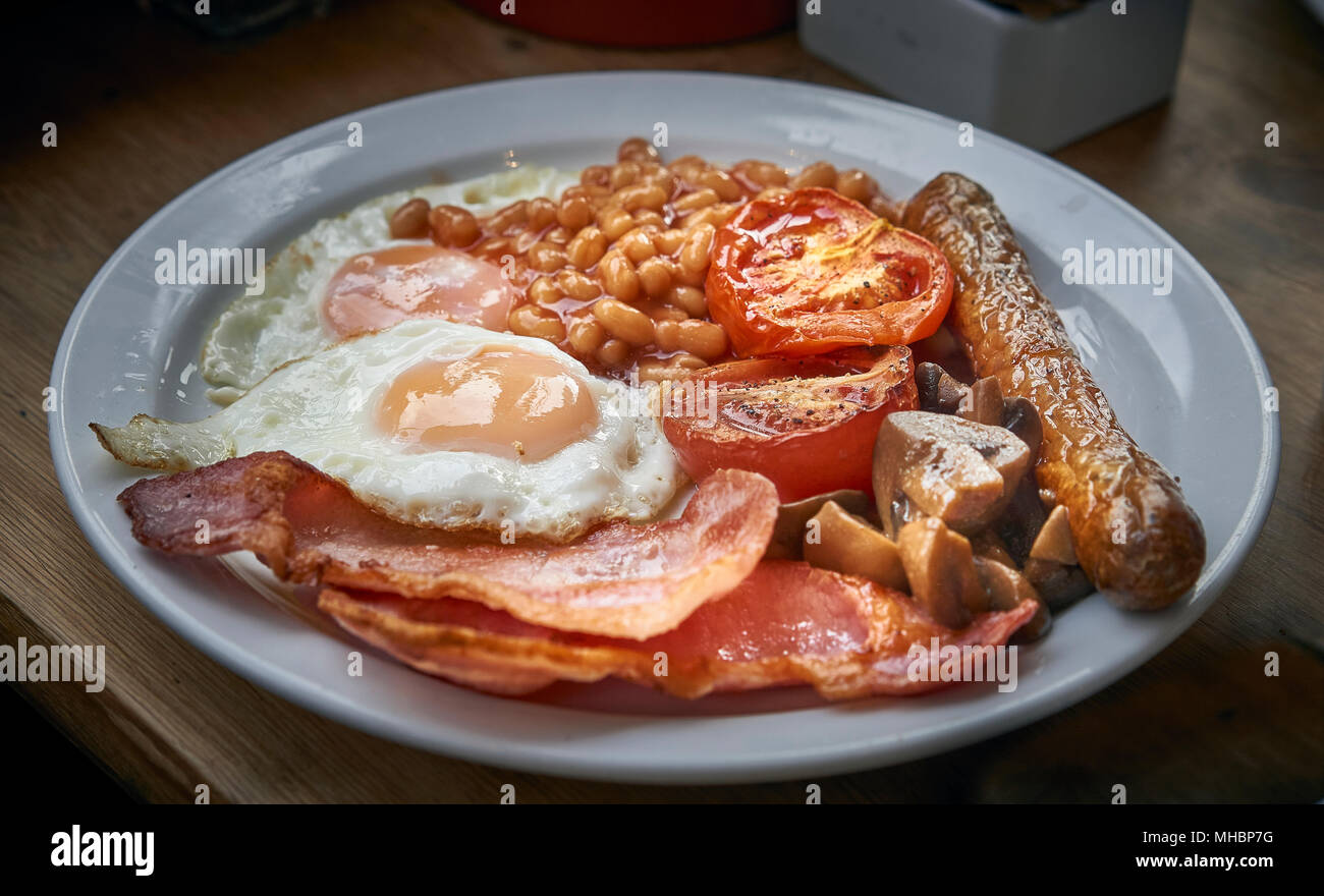 Classic English cooked Breakfast on a white plate Stock Photo - Alamy