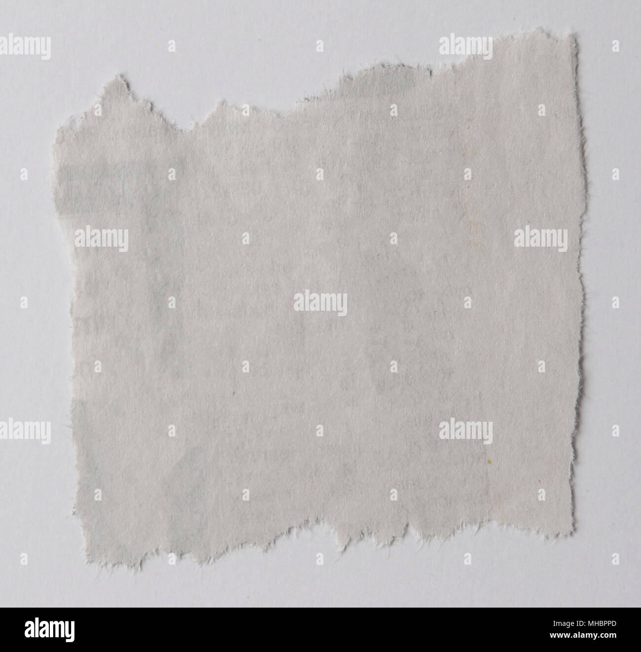 Piece of torn paper on plain background Stock Photo - Alamy