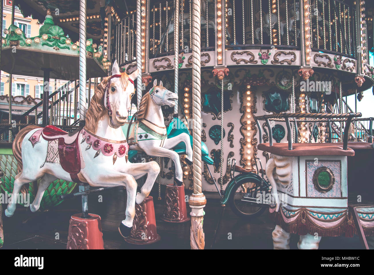 An old fashioned carousel in Nice, France. Retro toned Stock Photo - Alamy