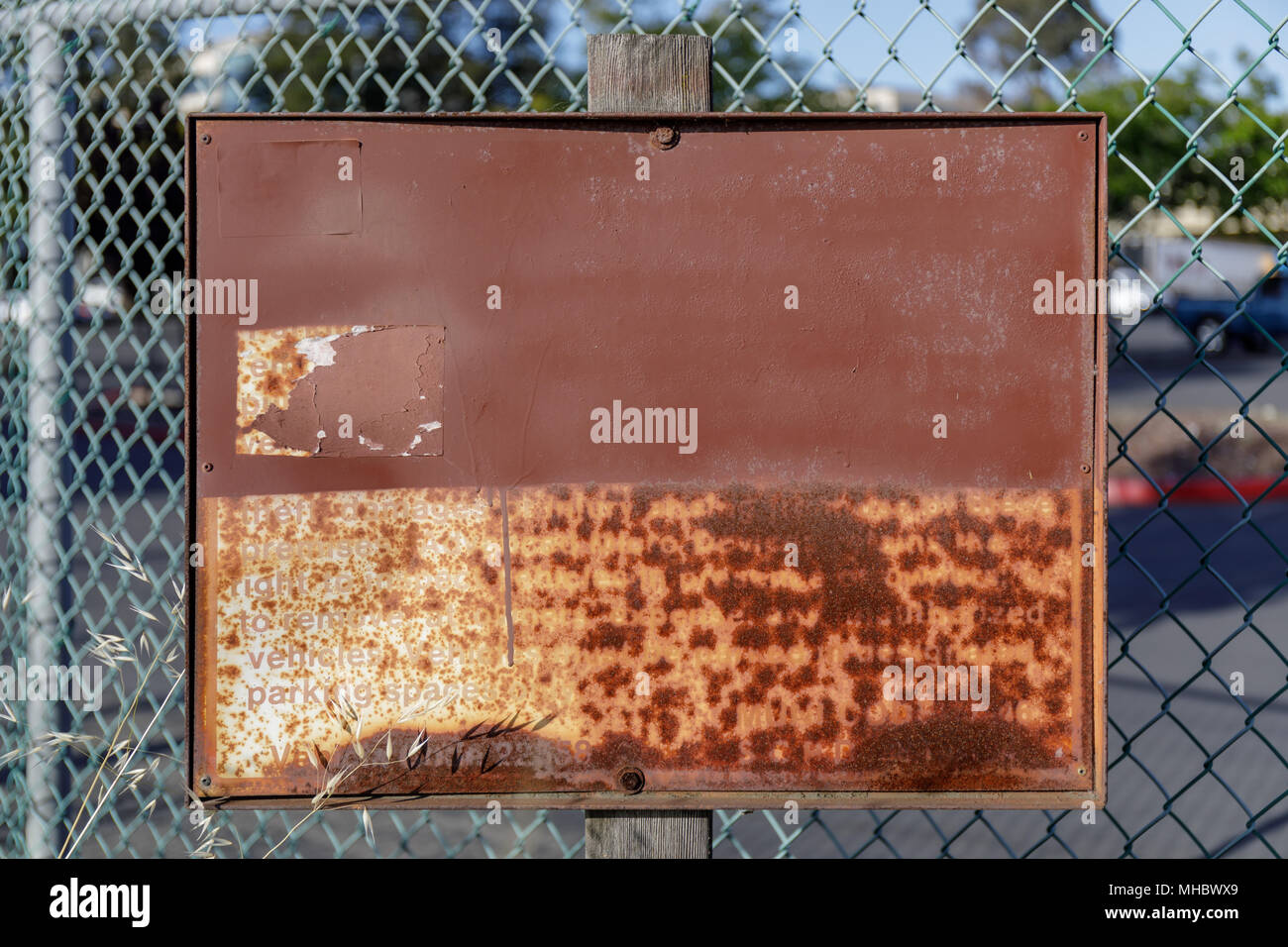 Old rusty sign with illegible text (English Stock Photo - Alamy