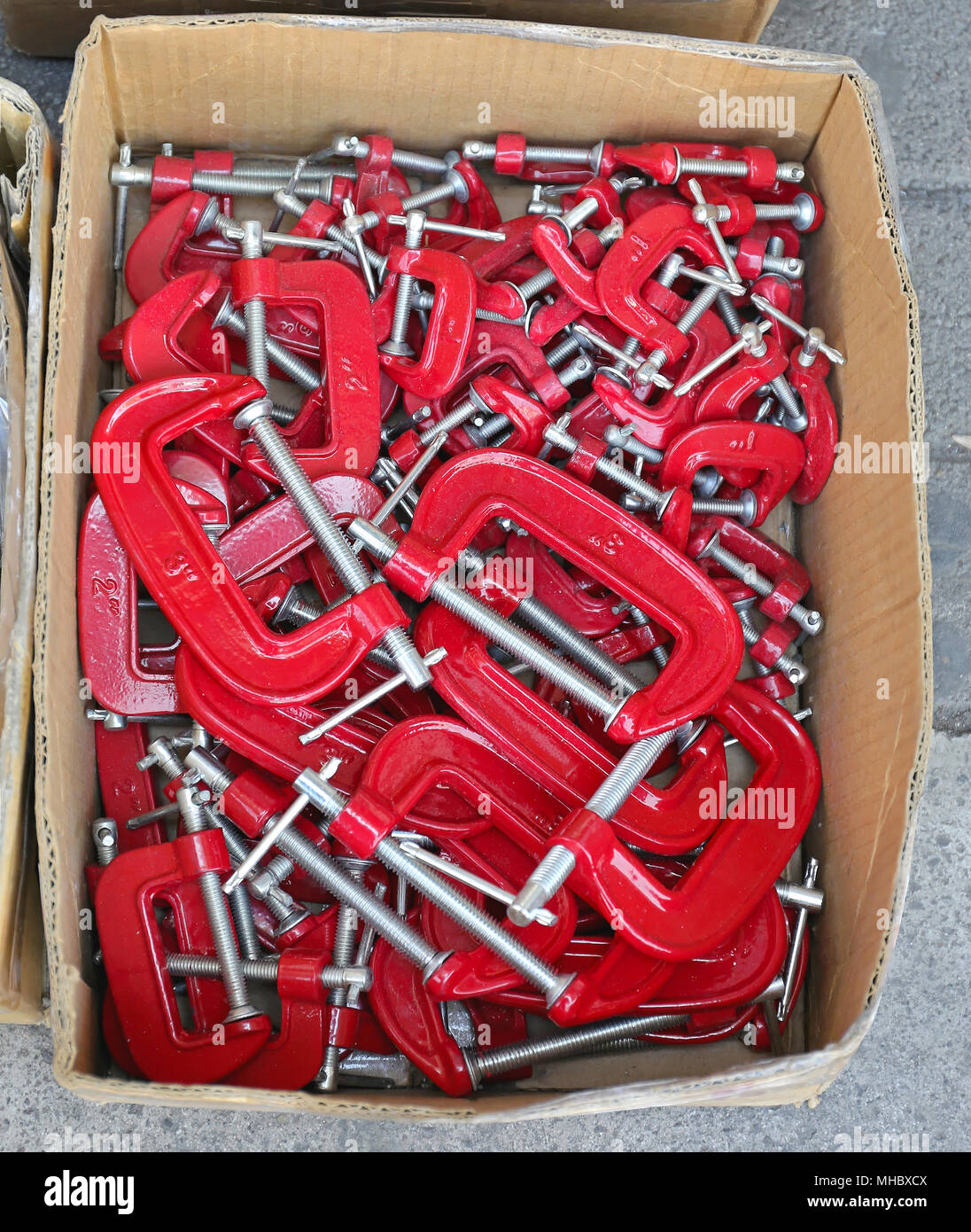 Bunch of Red Clamps in the Box Stock Photo - Alamy