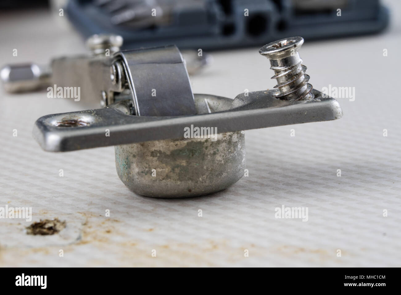 Assembly of hinges in a carpentry workshop. Joinery accessories in a ...
