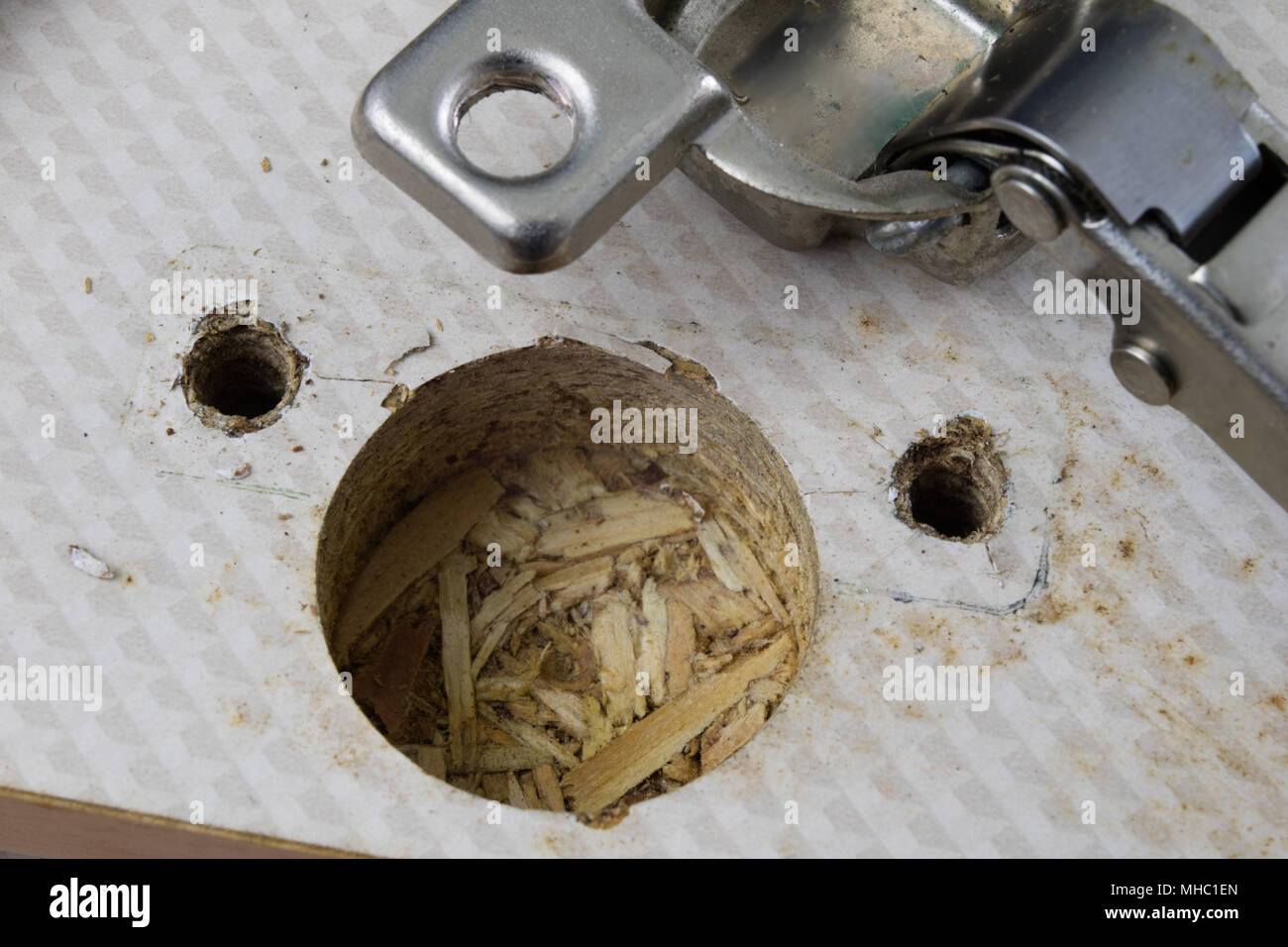 Assembly of hinges in a carpentry workshop. Joinery accessories in a ...