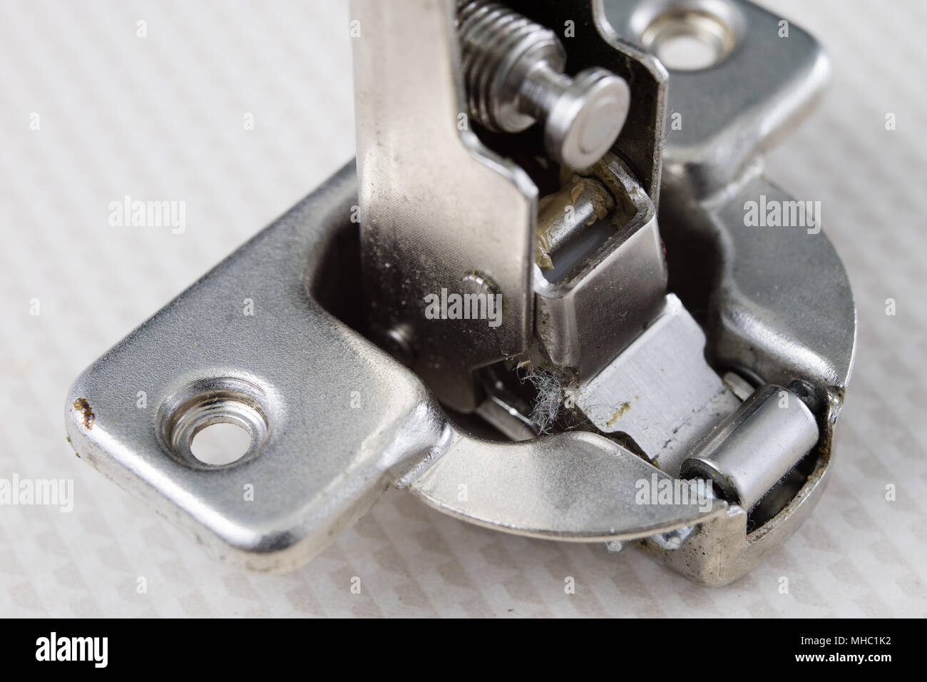 Assembly of hinges in a carpentry workshop. Joinery accessories in a ...