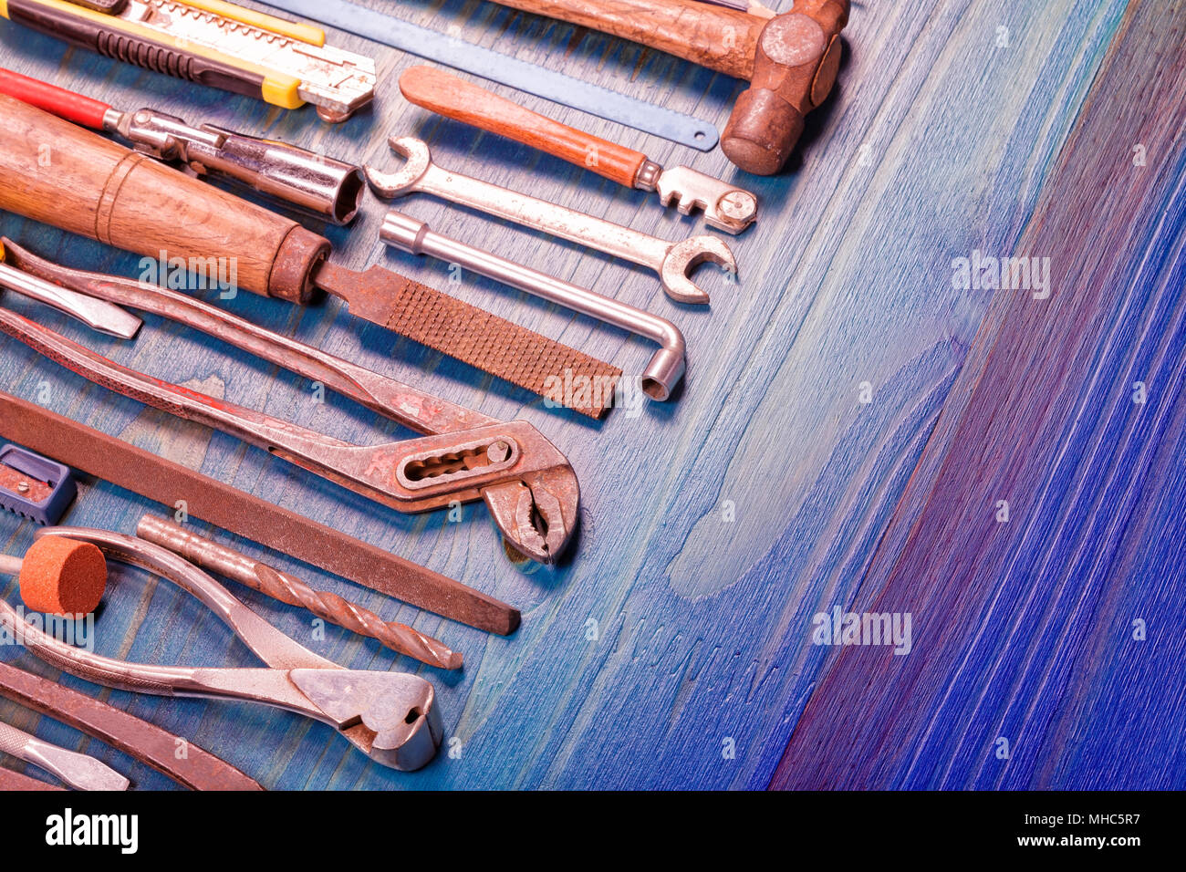 Many manual tools on wood painted blue color background Stock Photo - Alamy