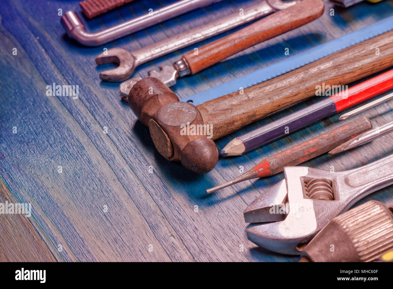 Many manual tools on wood painted blue color background Stock Photo - Alamy