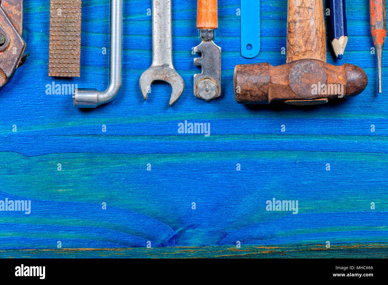 Many manual tools on wood painted blue color background Stock Photo - Alamy