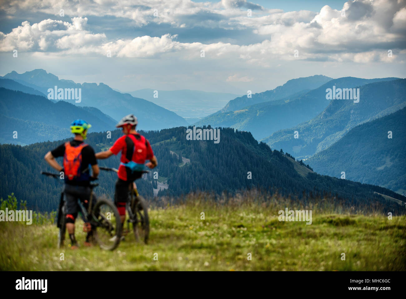 Two man on mountain bikes stop to admire the view near the French ...