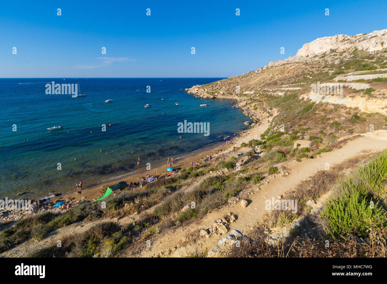 Beautiful azure blue water of Selmun beach in the summer time, in ...