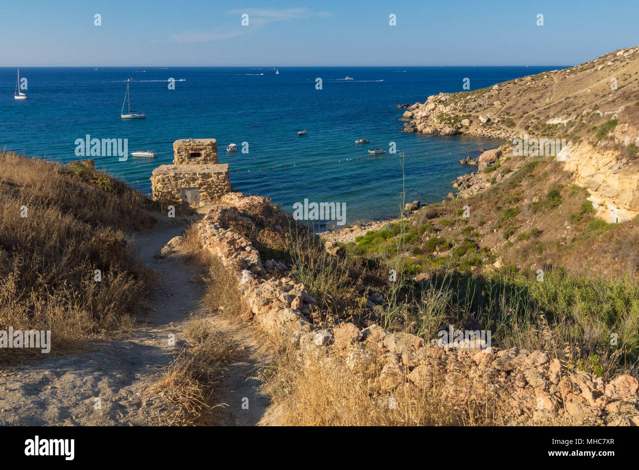 Beautiful azure blue water of Selmun beach in the summer time, in ...