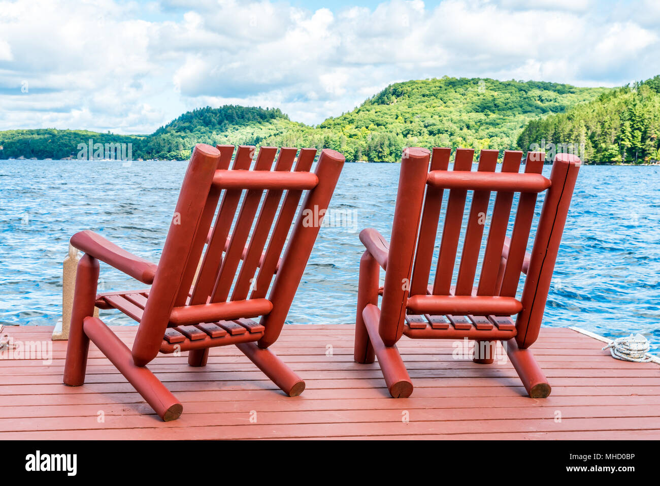 Dock and muskoka chairs on lake muskoka hi-res stock photography and ...