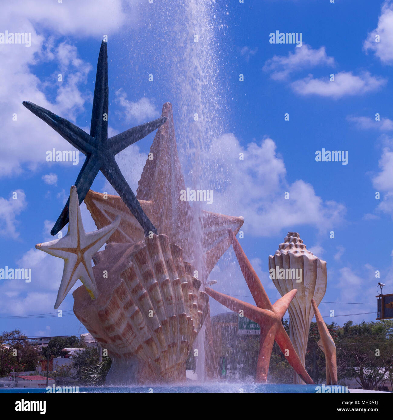 Downtown Cancun has a central fountain with gigantic seashells and ...