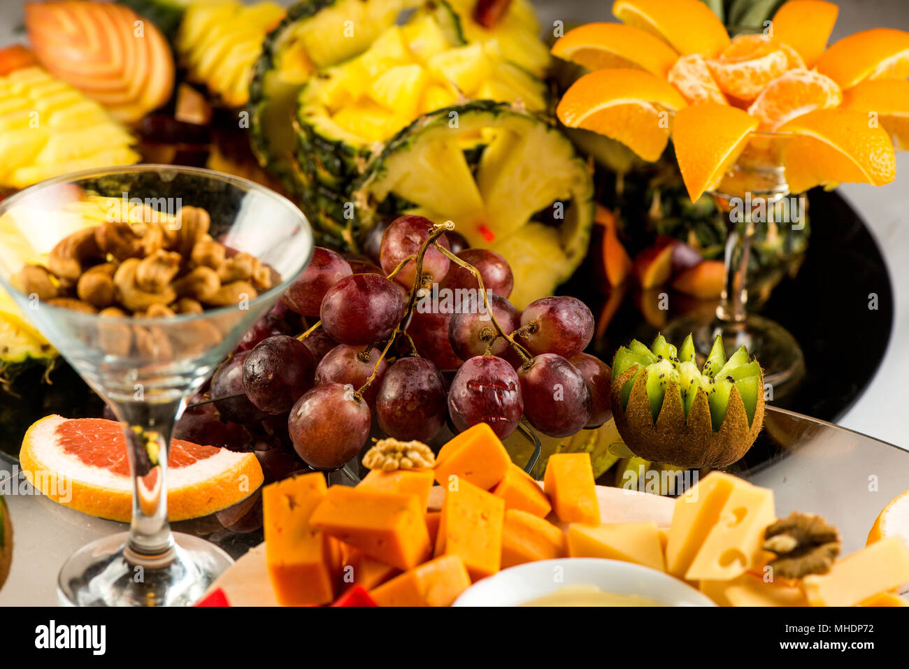 Assortment of cheeses, fruits, and snacks for the holiday Stock Photo ...