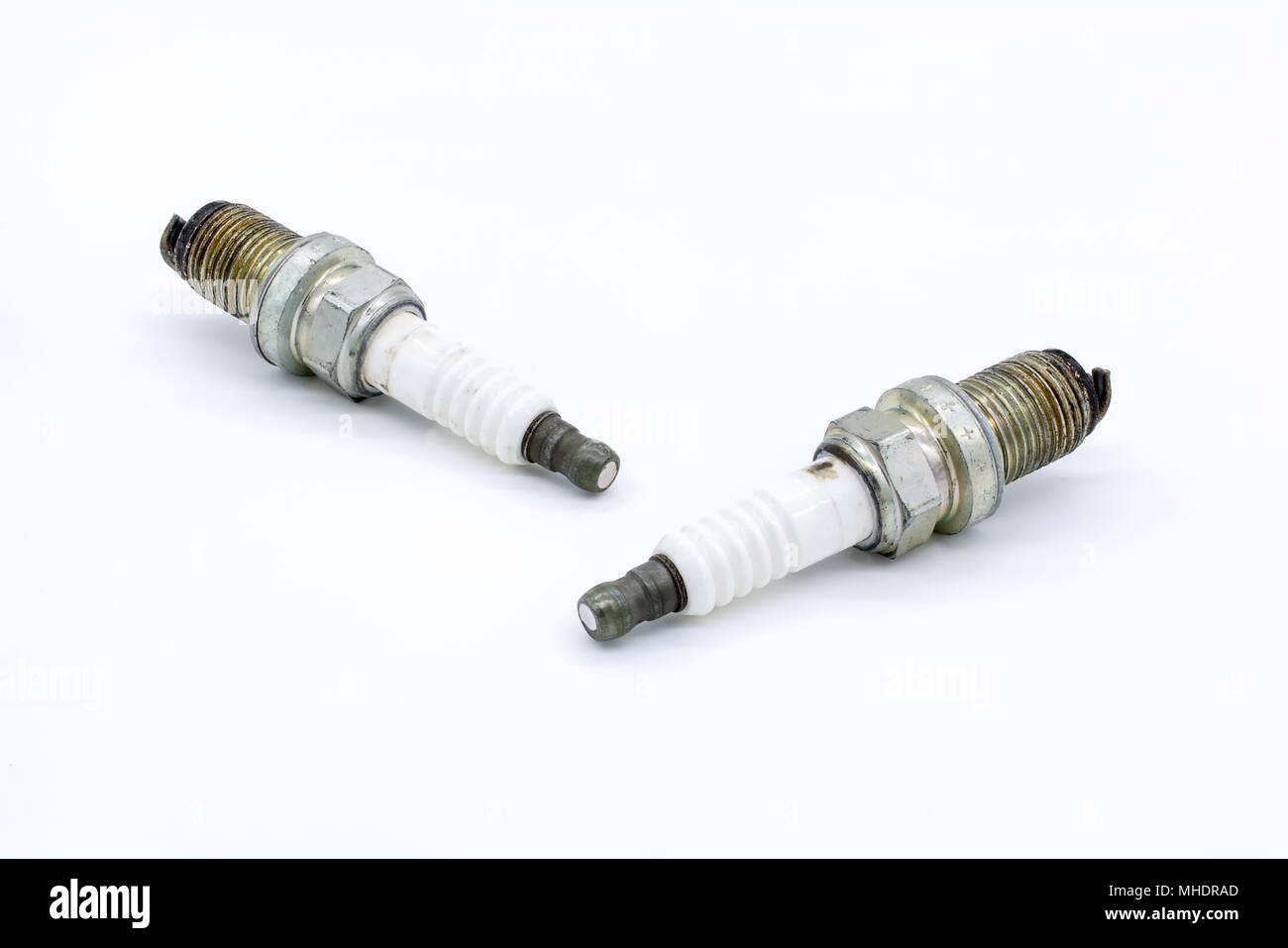 Old spark plug isolated on the white Stock Photo - Alamy