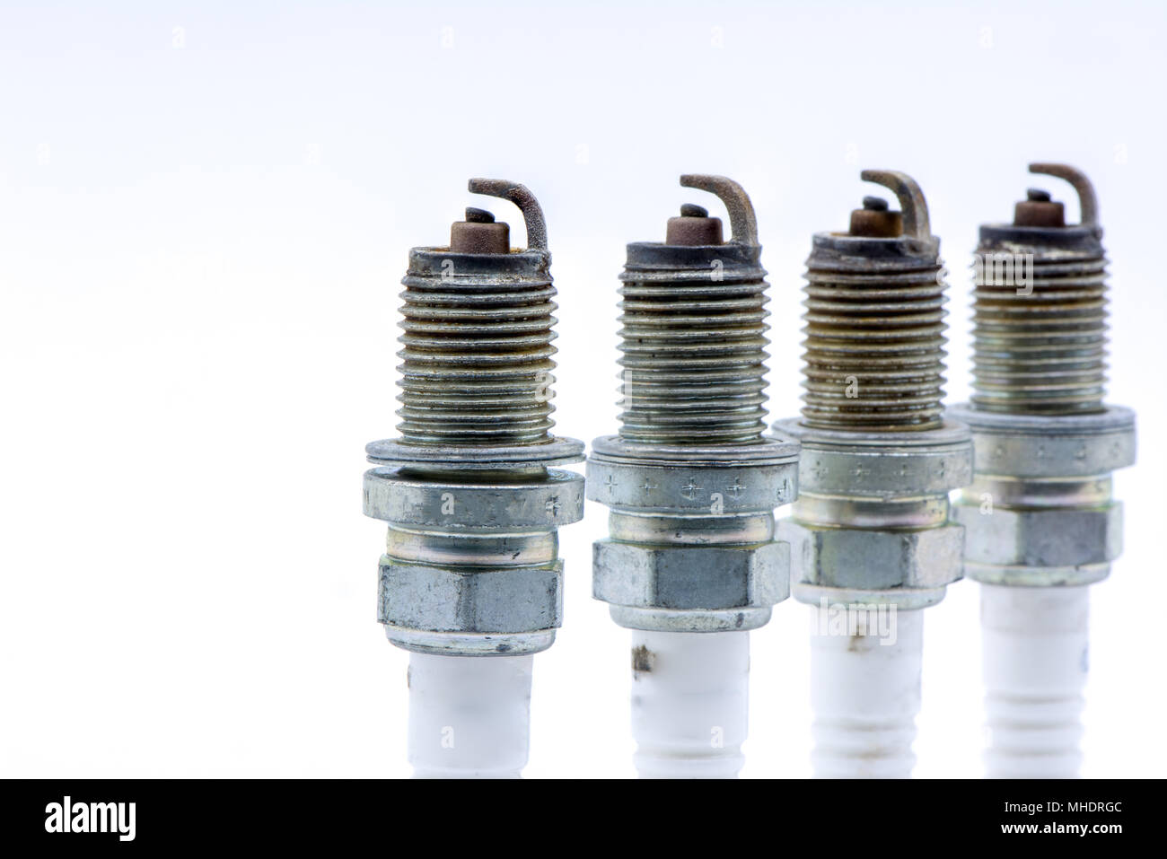Old spark plug isolated on the white Stock Photo - Alamy