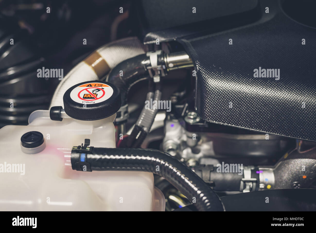 Coolant tank and warning information in engine room Stock Photo - Alamy