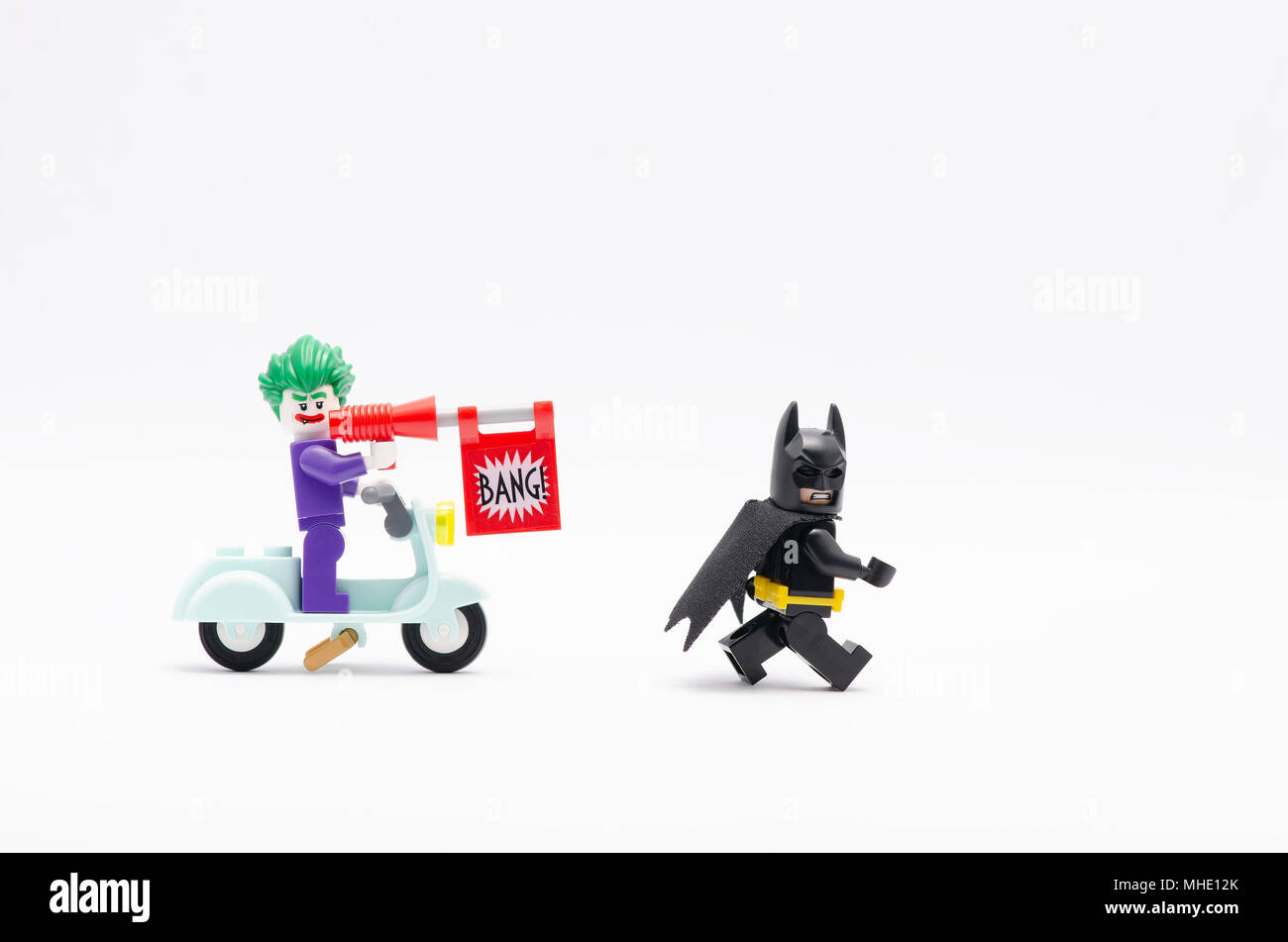 mini figure of joker riding scooter with bang gun chasing batman. Lego ...