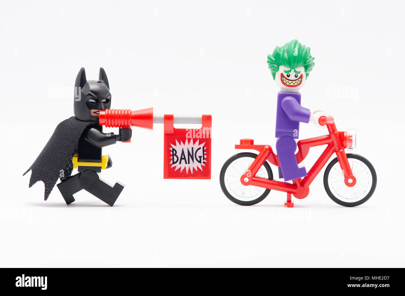 mini figure of batman with bang gun chasing joker riding a bicycle ...