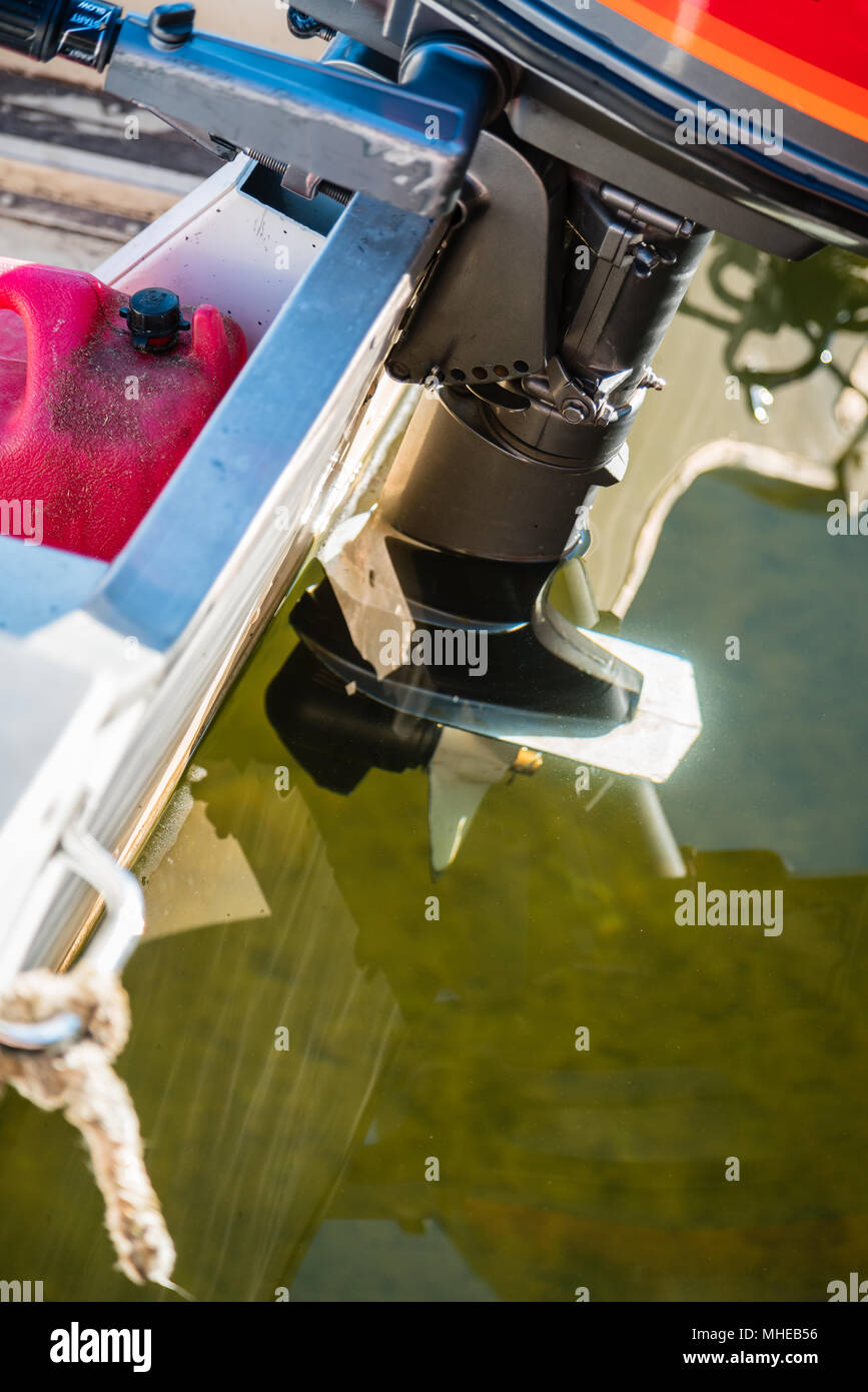 Summer motor boating, close-up of prop in the water off the back of a ...