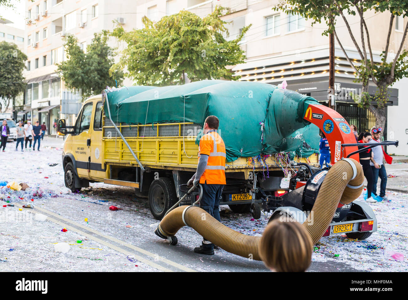 Street sweeper machine cleaning the street after a carnival party Stock ...