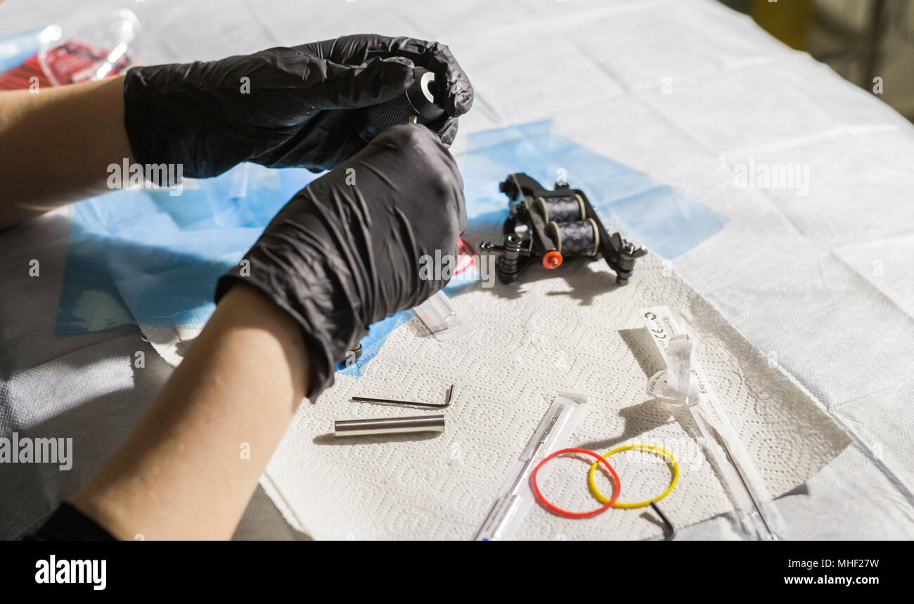 master tattoo artist prepares tools for tattooing Stock Photo - Alamy