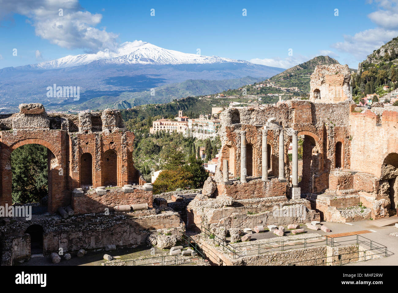 Ancient Greek-Roman theatre of Taormina with town and Mount Etna ...