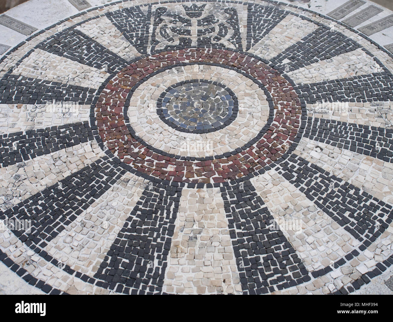 Ceramic Sun Dial Art On The Ground Stock Photo - Alamy