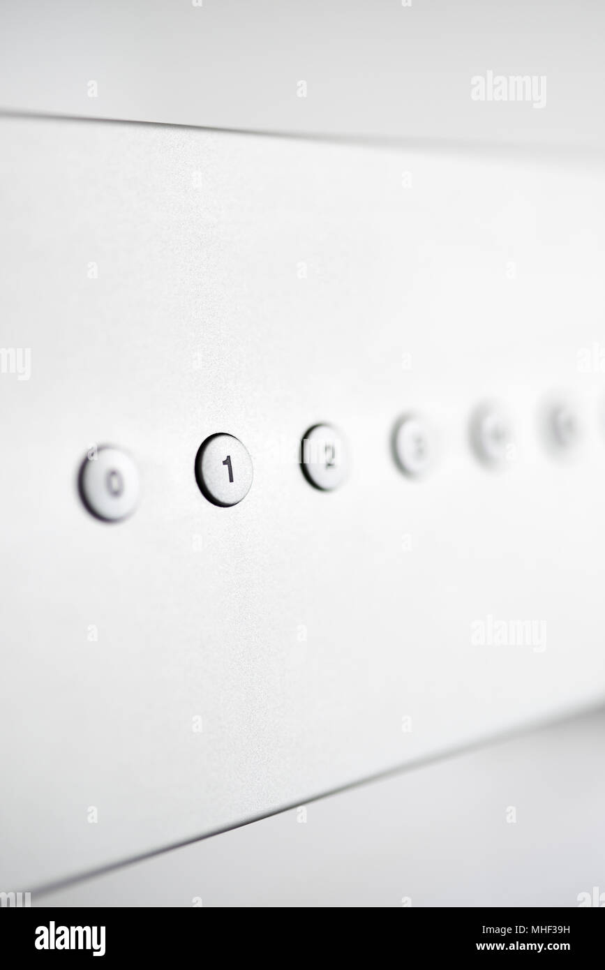 Buttons at a cooker hood of steel Stock Photo - Alamy