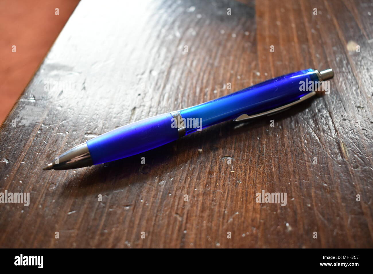 Pen on desk Stock Photo - Alamy