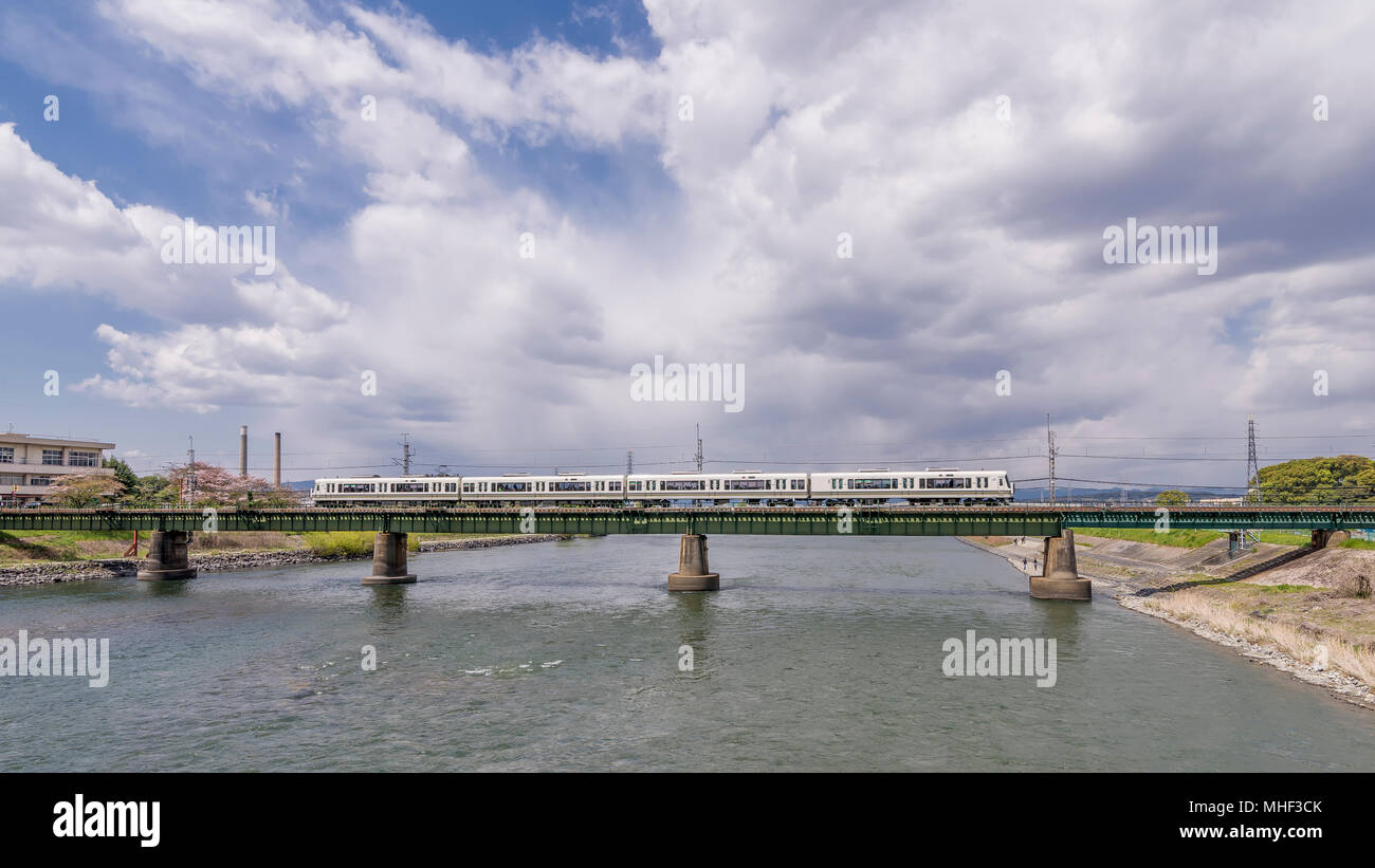 Beautiful view of the railway bridge on the river Uji with the train ...