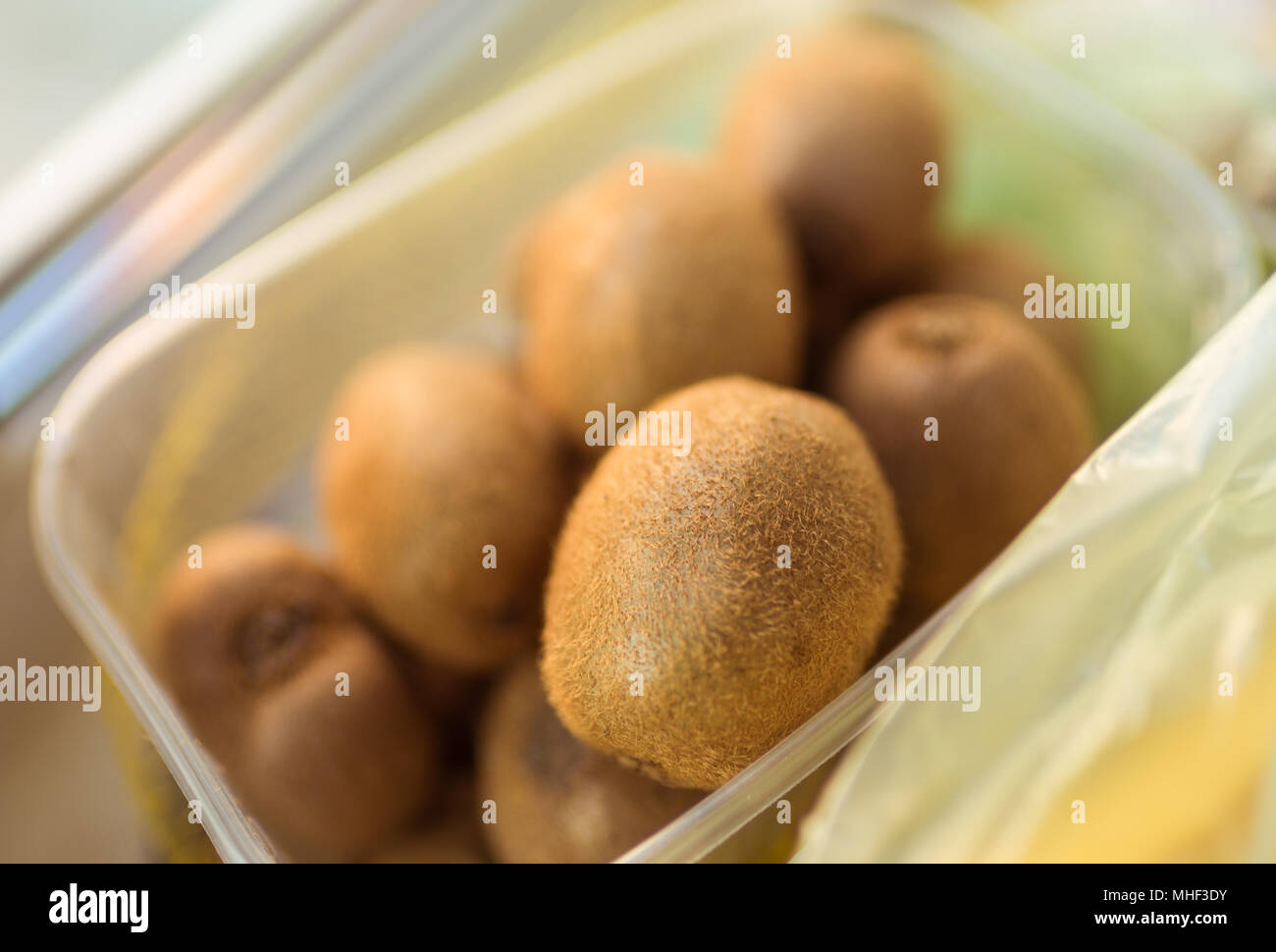 Kiwi in a plastic container Stock Photo - Alamy