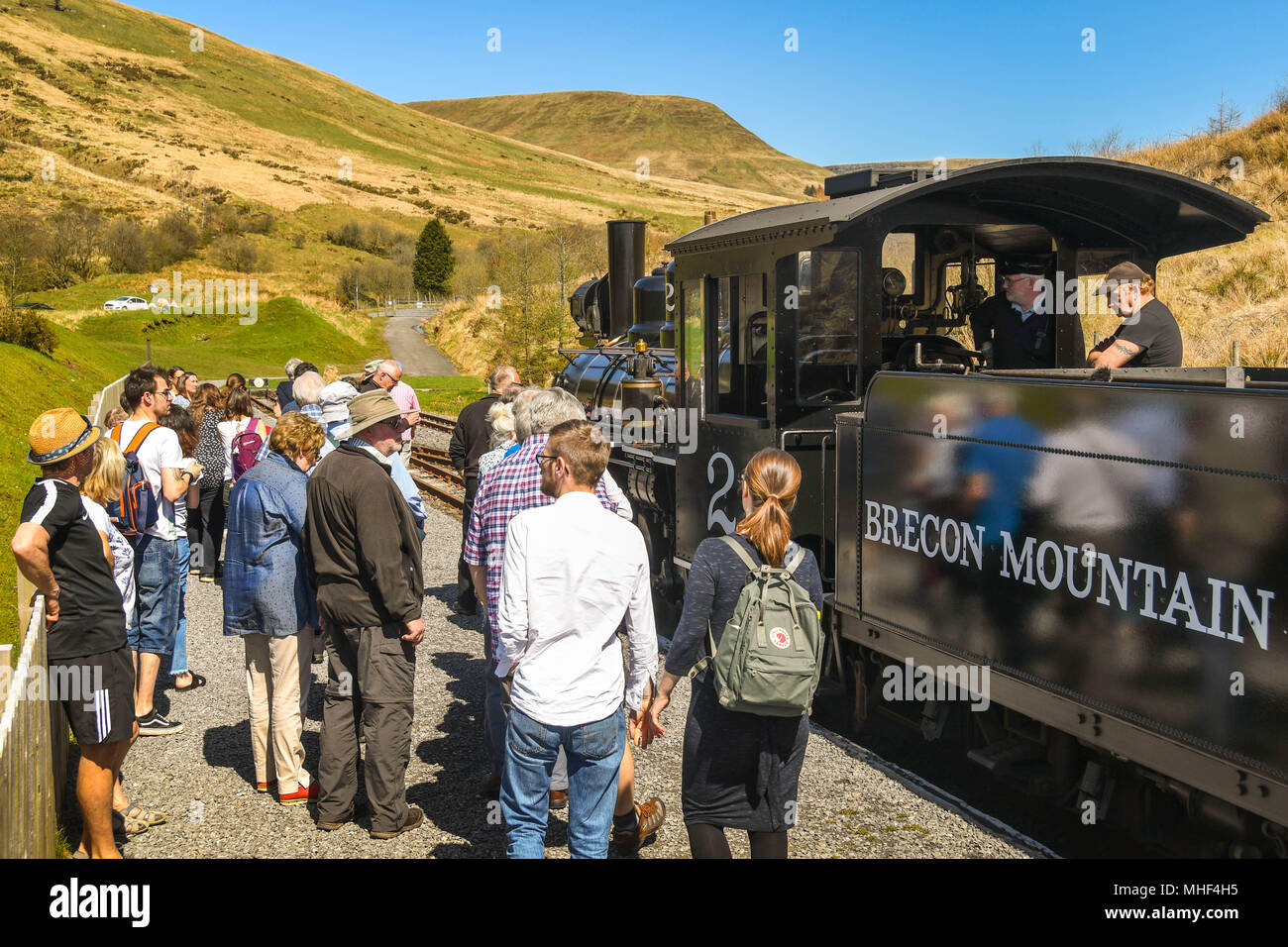 Passengers admiring one of the steam engines on the Brecon Mountain ...