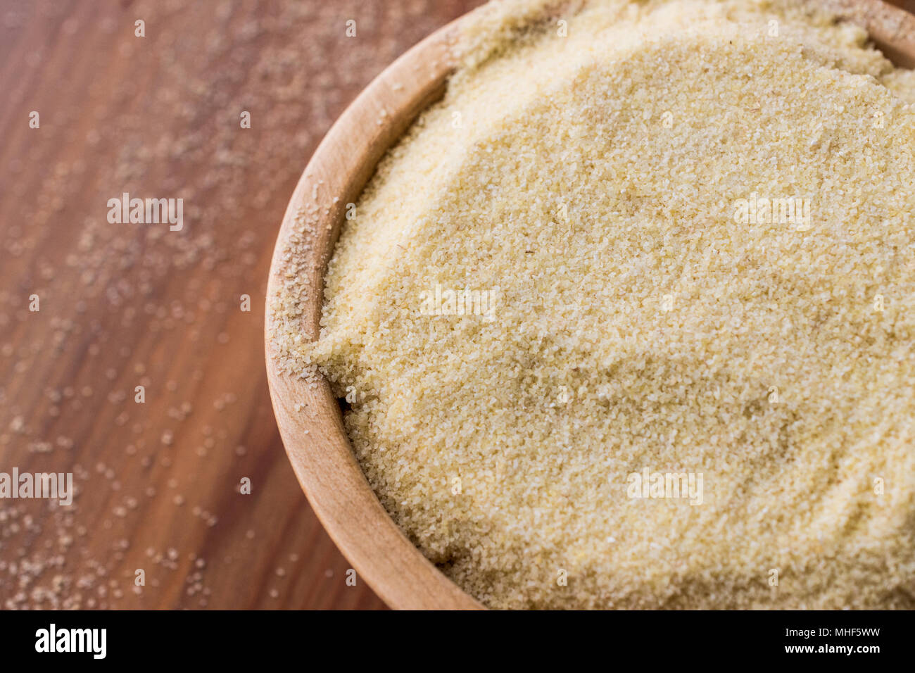 Raw unprepared semolina in wooden bowl. Organic Product Stock Photo - Alamy