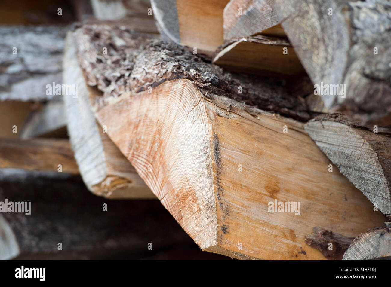 Wood Logs on countryside background Stock Photo - Alamy