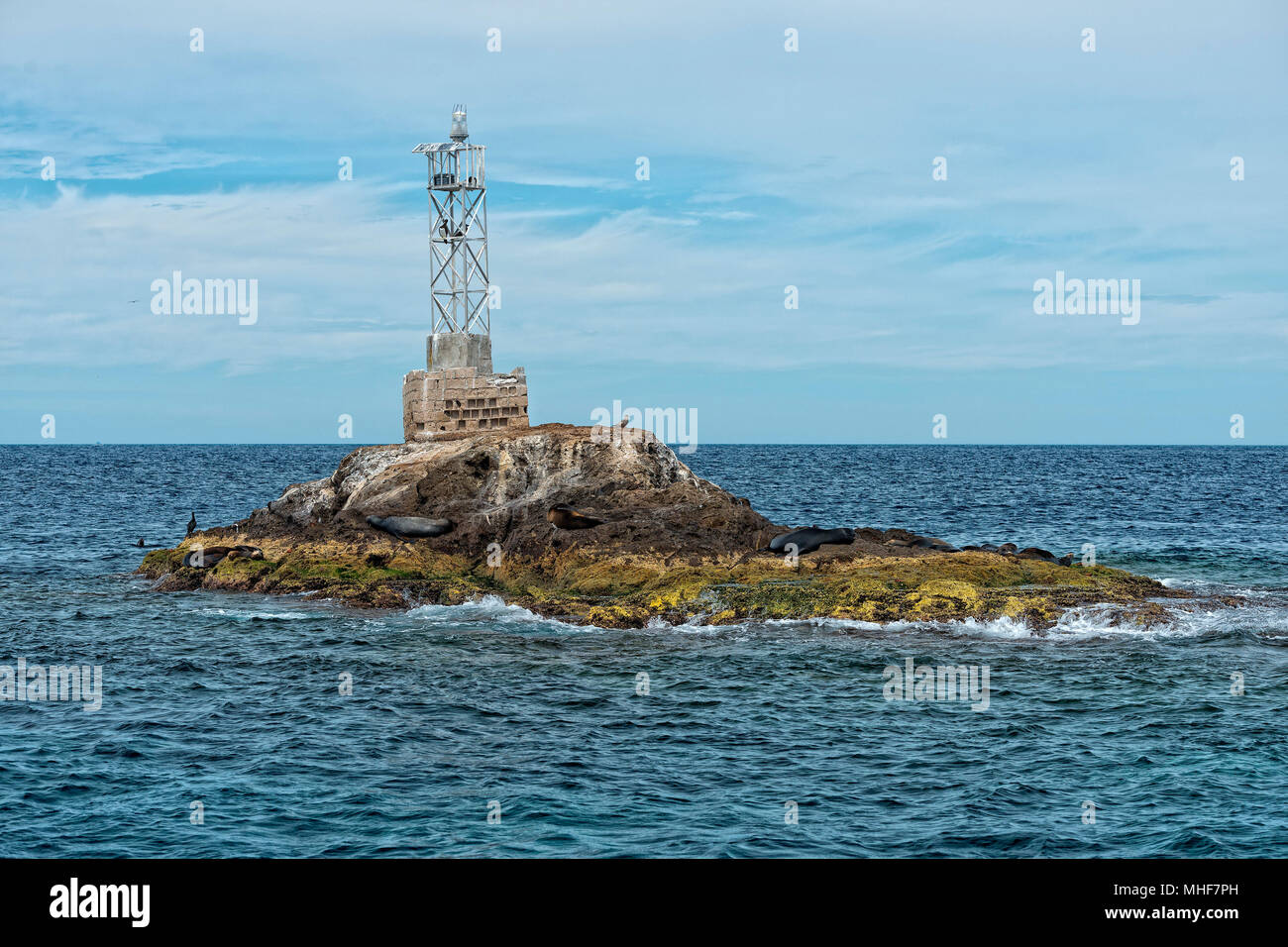 abandoned lighthouse on small rocks island Stock Photo - Alamy