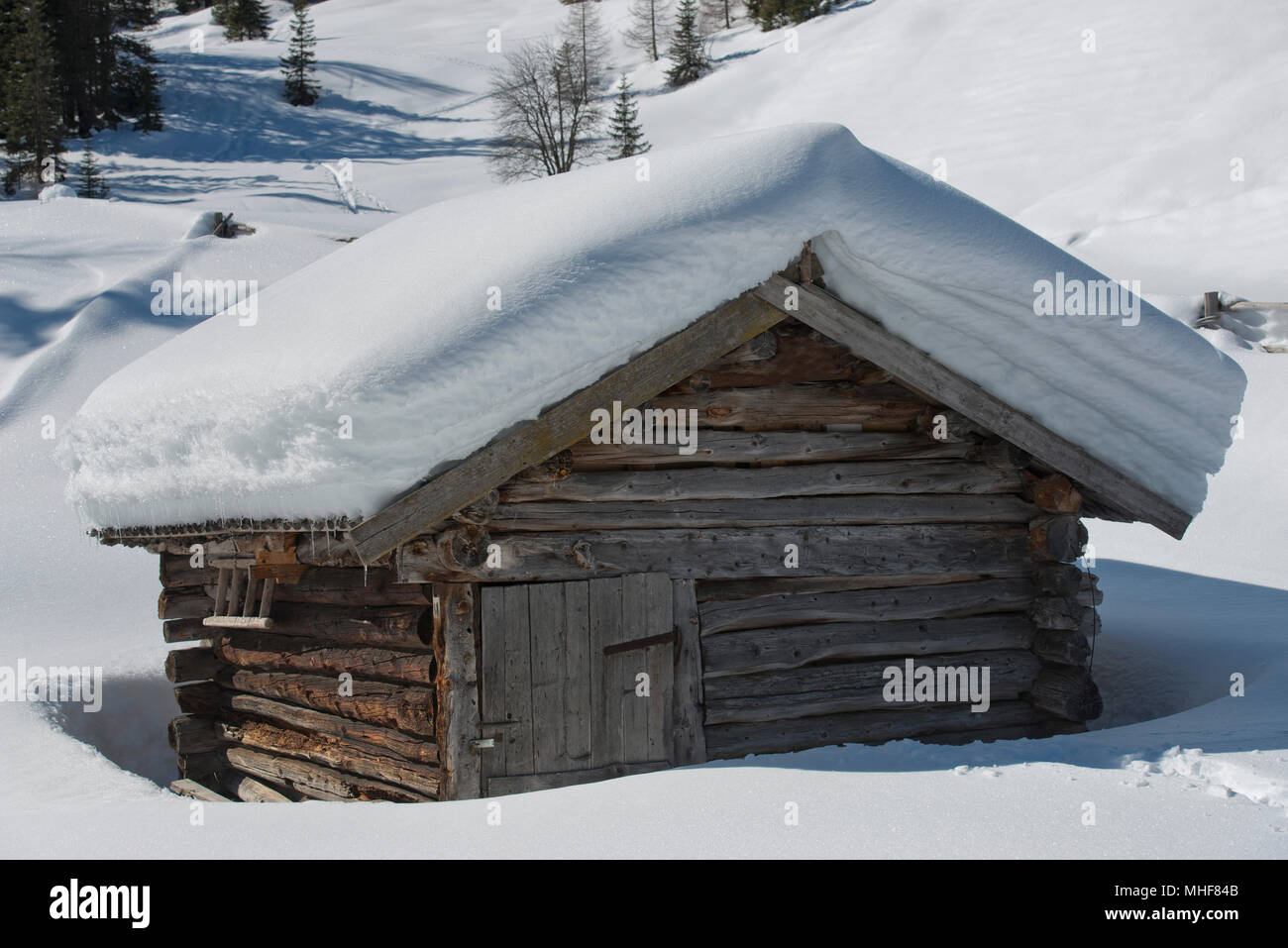 Isolated wood mountain house covered by snow Stock Photo - Alamy