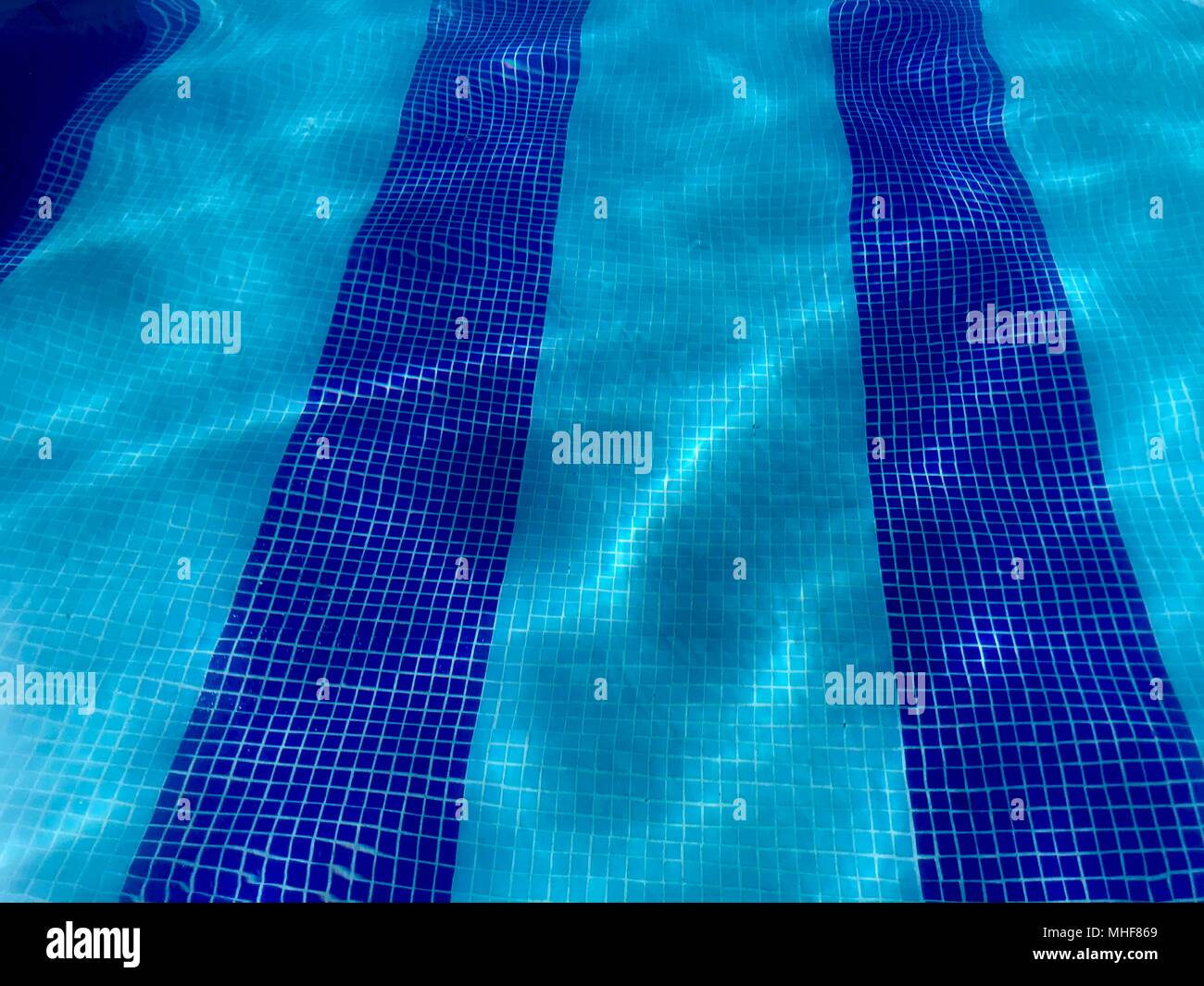 swimming pool blue crystal waters in tropical beach paradise Stock ...
