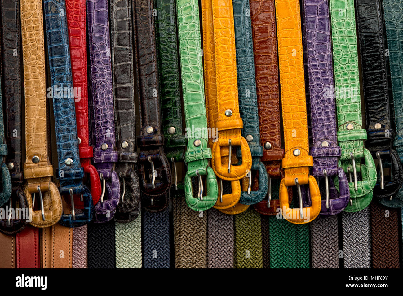 different colors leather belt on display Stock Photo - Alamy