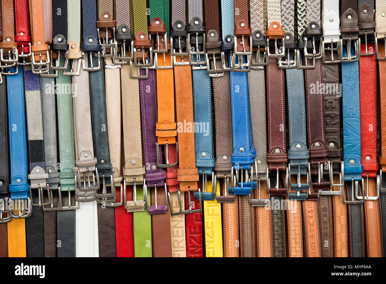 different colors leather belt on display Stock Photo - Alamy