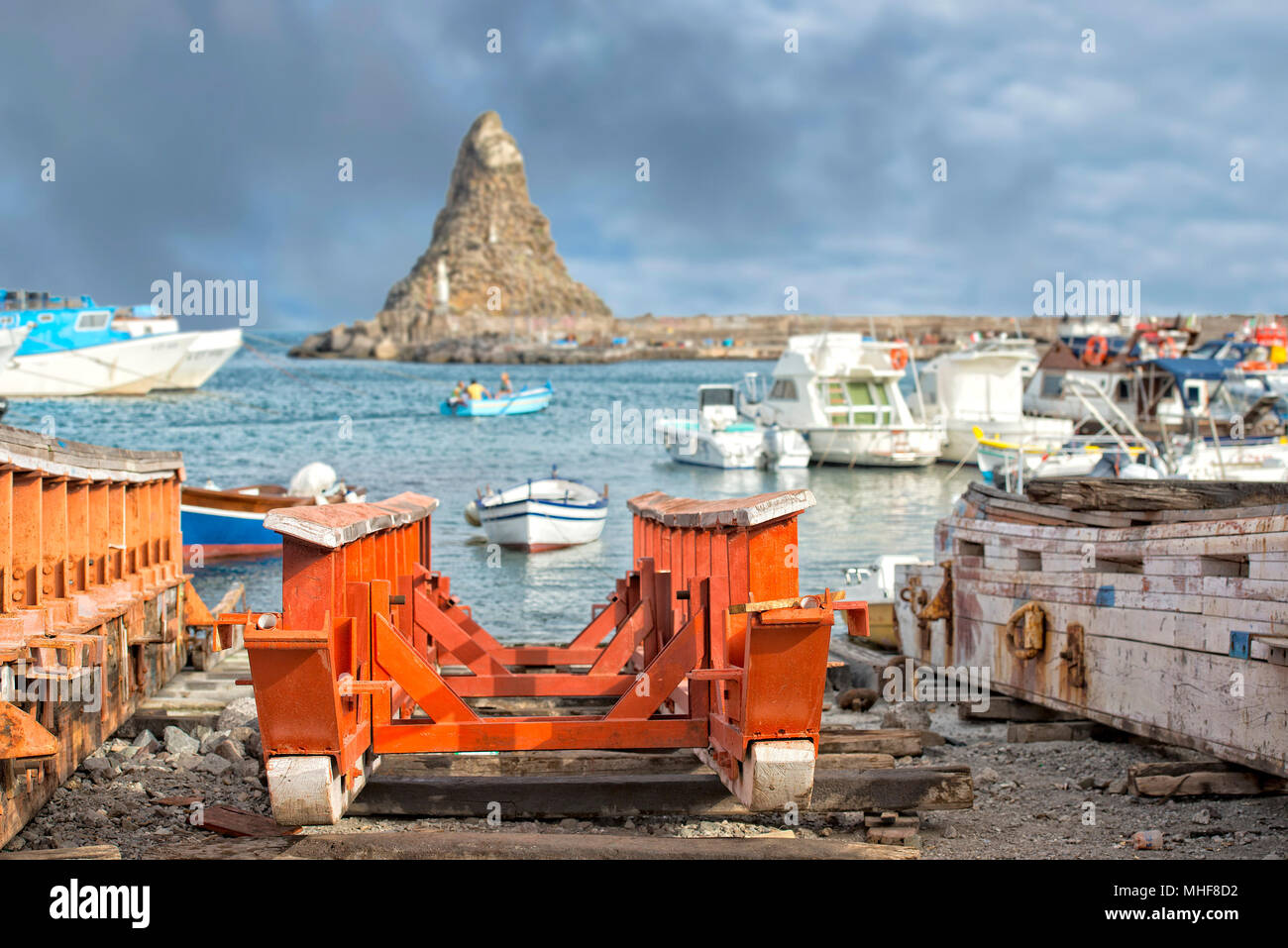 Aci Trezza Sicily Cyclopes Stacks on sunset sky background Stock Photo ...