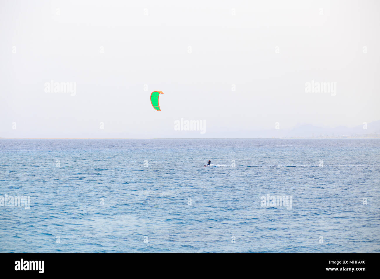Kitesurfer is riding the waves hi-res stock photography and images - Alamy