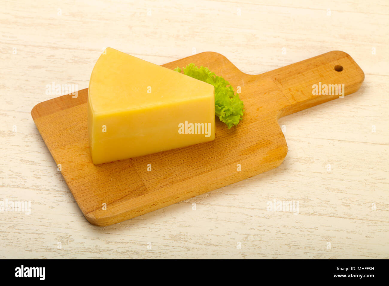 Parmesan cheese triangle Stock Photo - Alamy