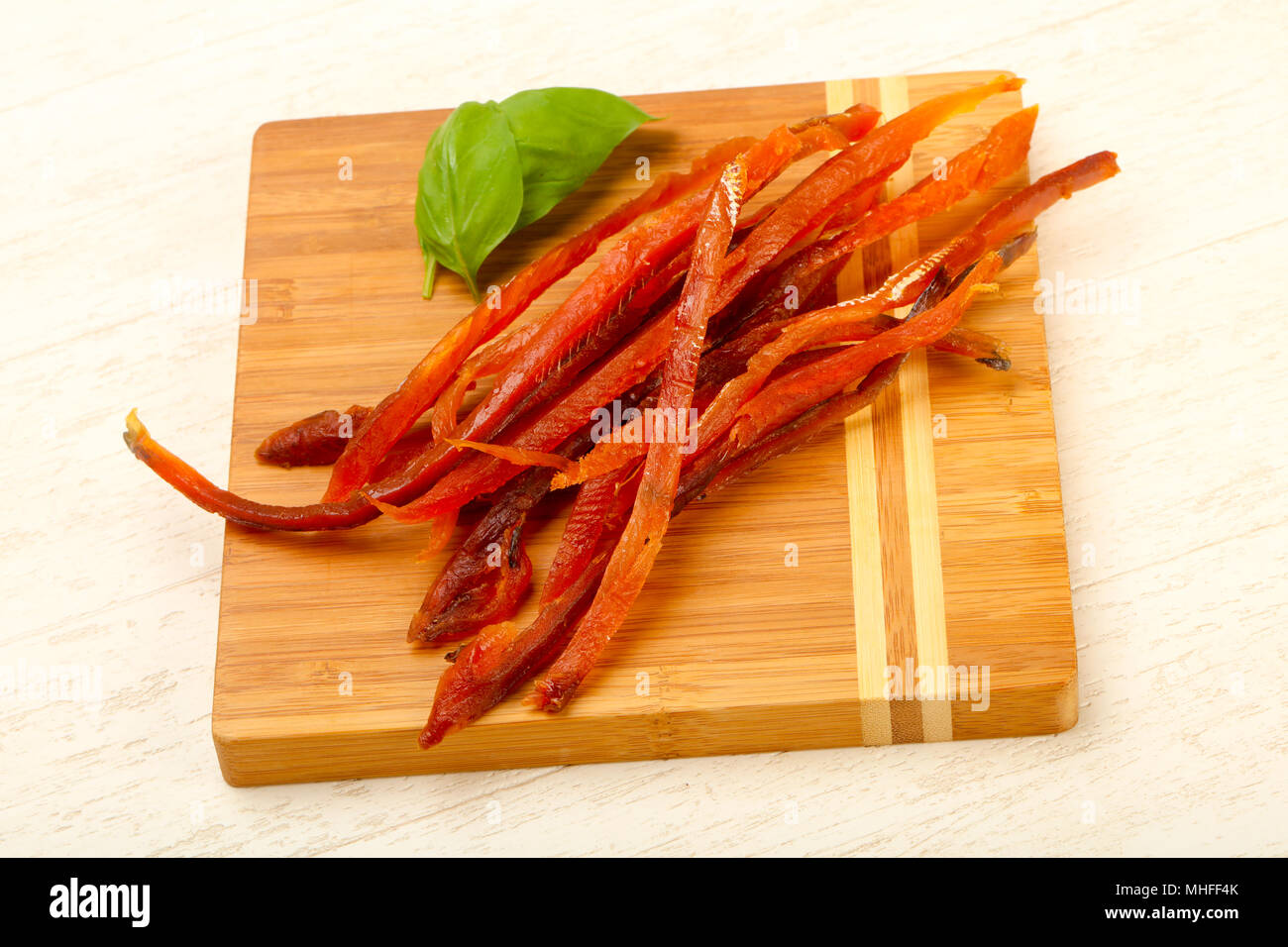 Salmon dry sticks snack Stock Photo - Alamy