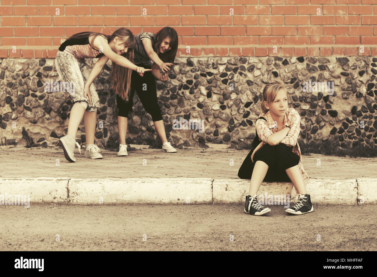 Teenage girls in conflict at the school building Stock Photo - Alamy