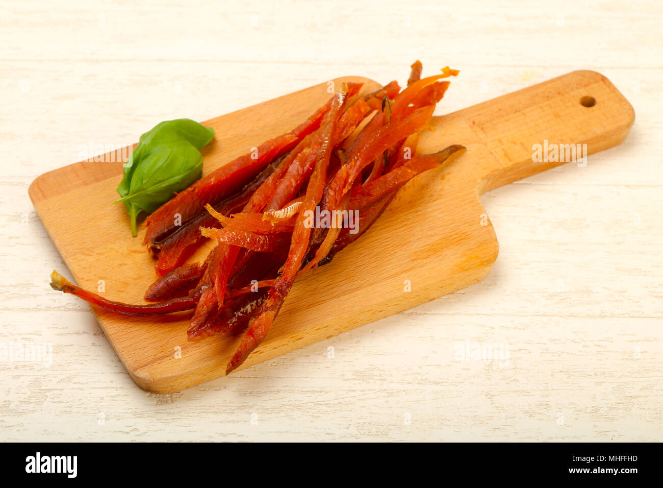Salmon dry sticks snack Stock Photo - Alamy
