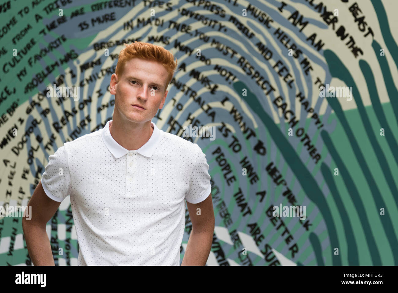 Portrait of a young male model with red hair. Outdoor portrait of a ...