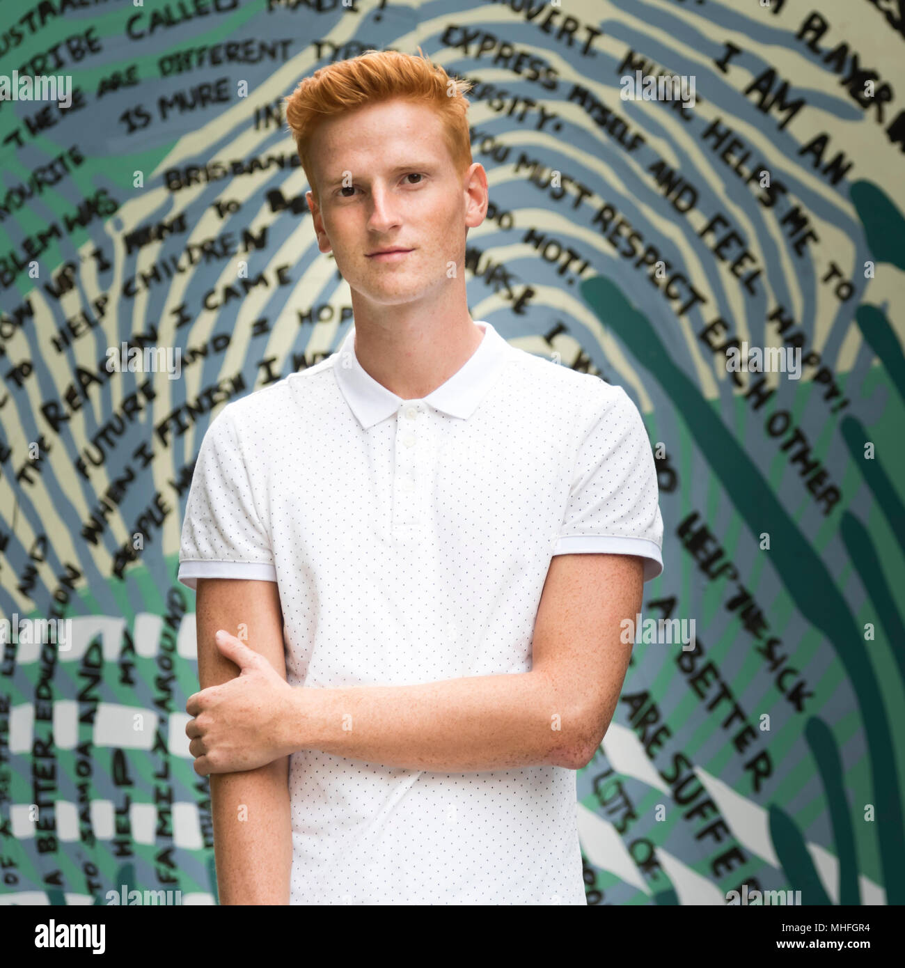 Portrait of a young male model with red hair. Outdoor portrait of a ...