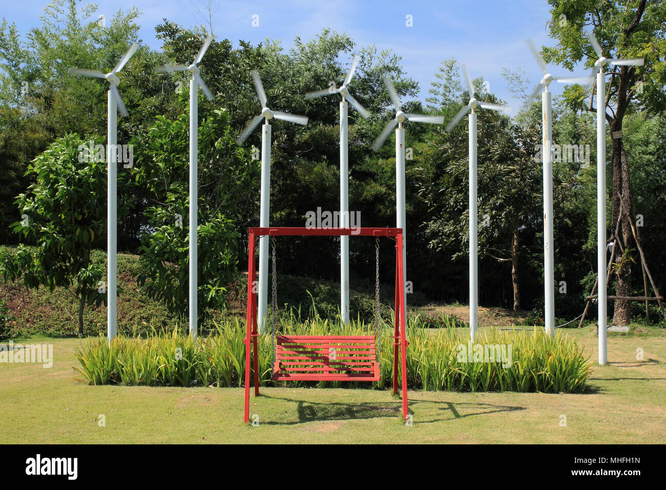 swing in garden and wind wheel background Stock Photo - Alamy